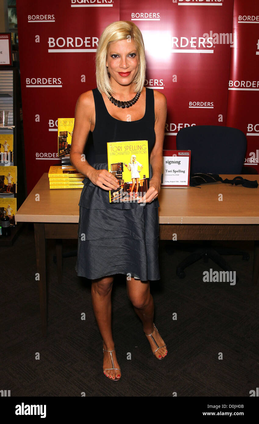 Tori Spelling signs copies of her book 'Uncharted Territori' at Borders ...