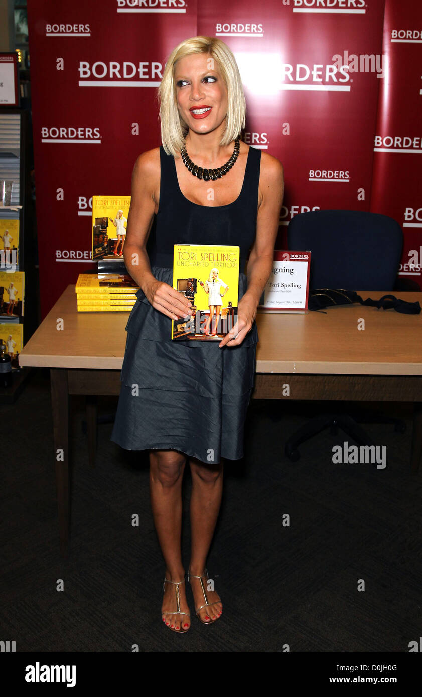 Tori Spelling signs copies of her book 'Uncharted Territori' at Borders ...