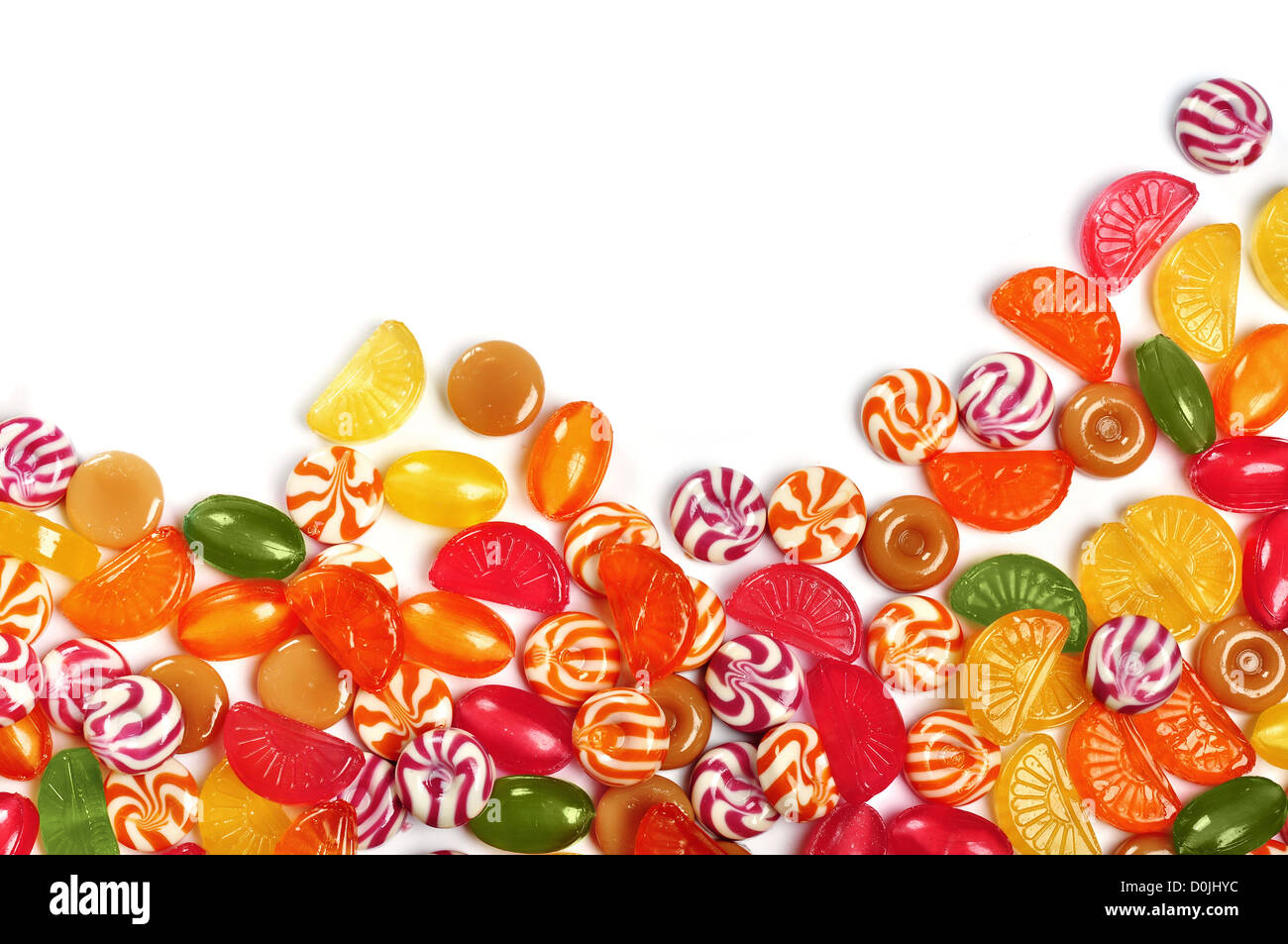 Mixed colorful fruit candy closeup over white background Stock Photo ...