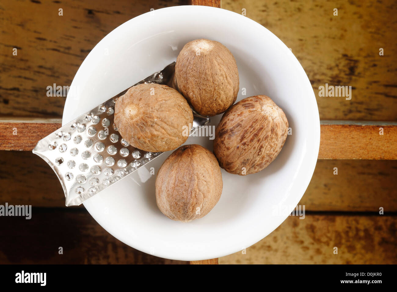 nutmeg and grater on wooden table background Stock Photo - Alamy