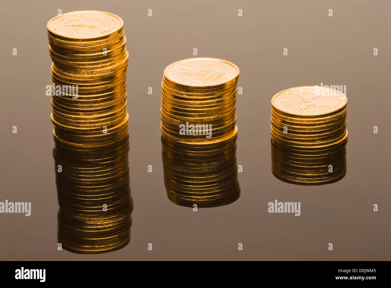 Stacks of gold coins Stock Photo - Alamy