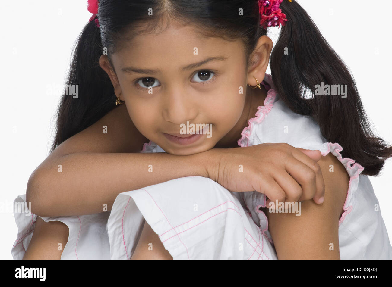 Portrait of a girl smirking Stock Photo - Alamy