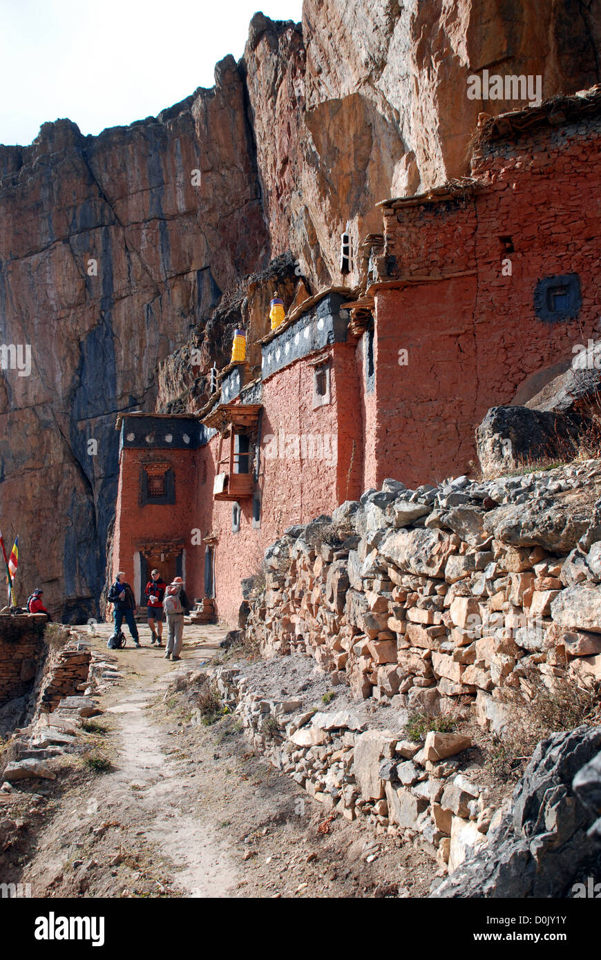 the monastery of Tsa Kang perched on a narrow ledge in the mountains ...