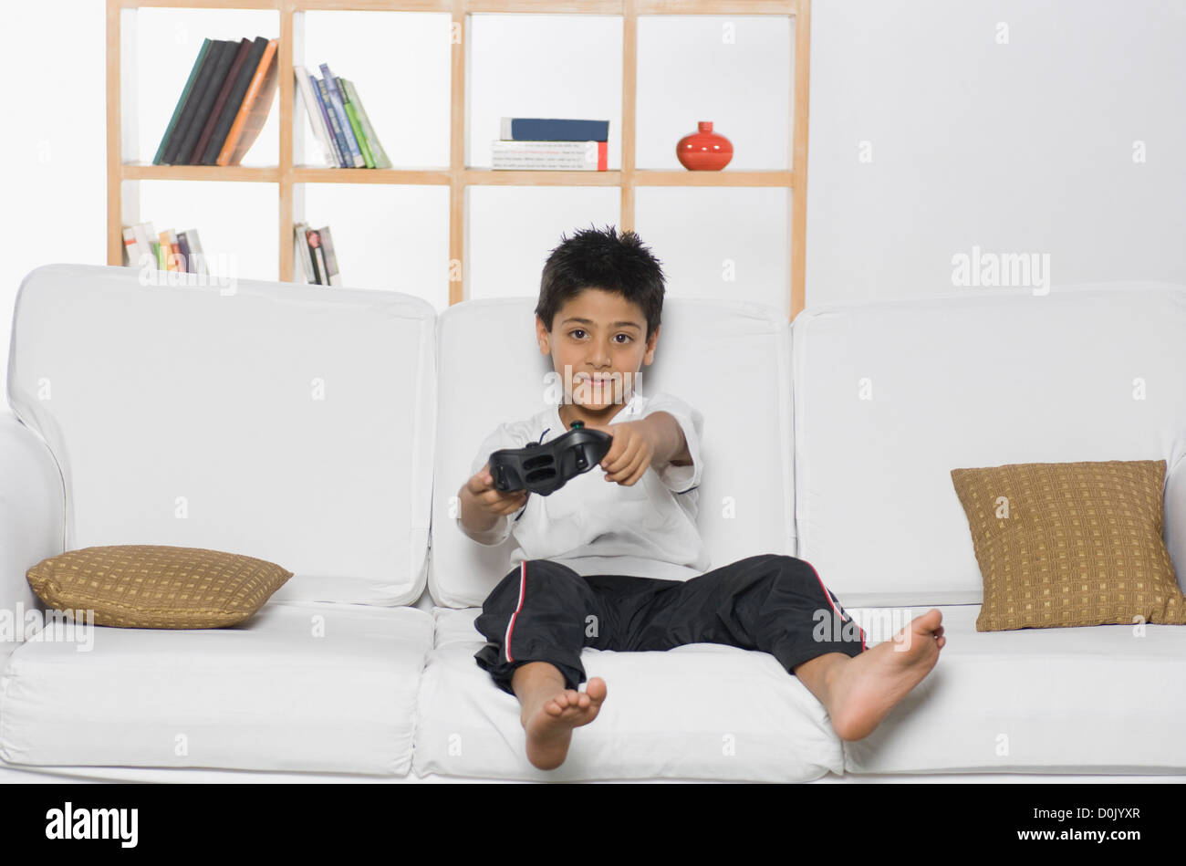 Boy playing handheld video game Stock Photo - Alamy