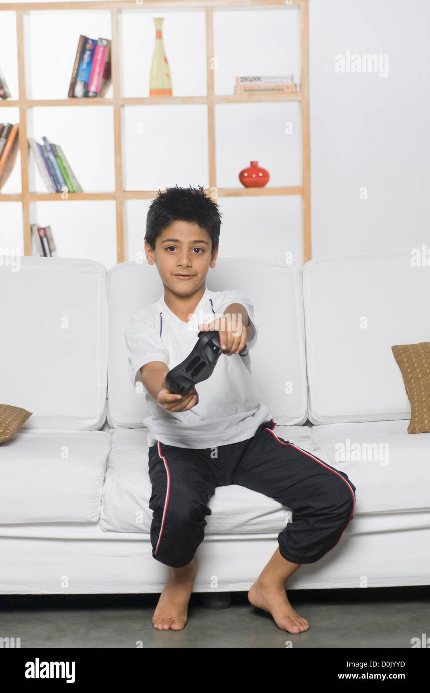 Boy playing handheld video game Stock Photo - Alamy