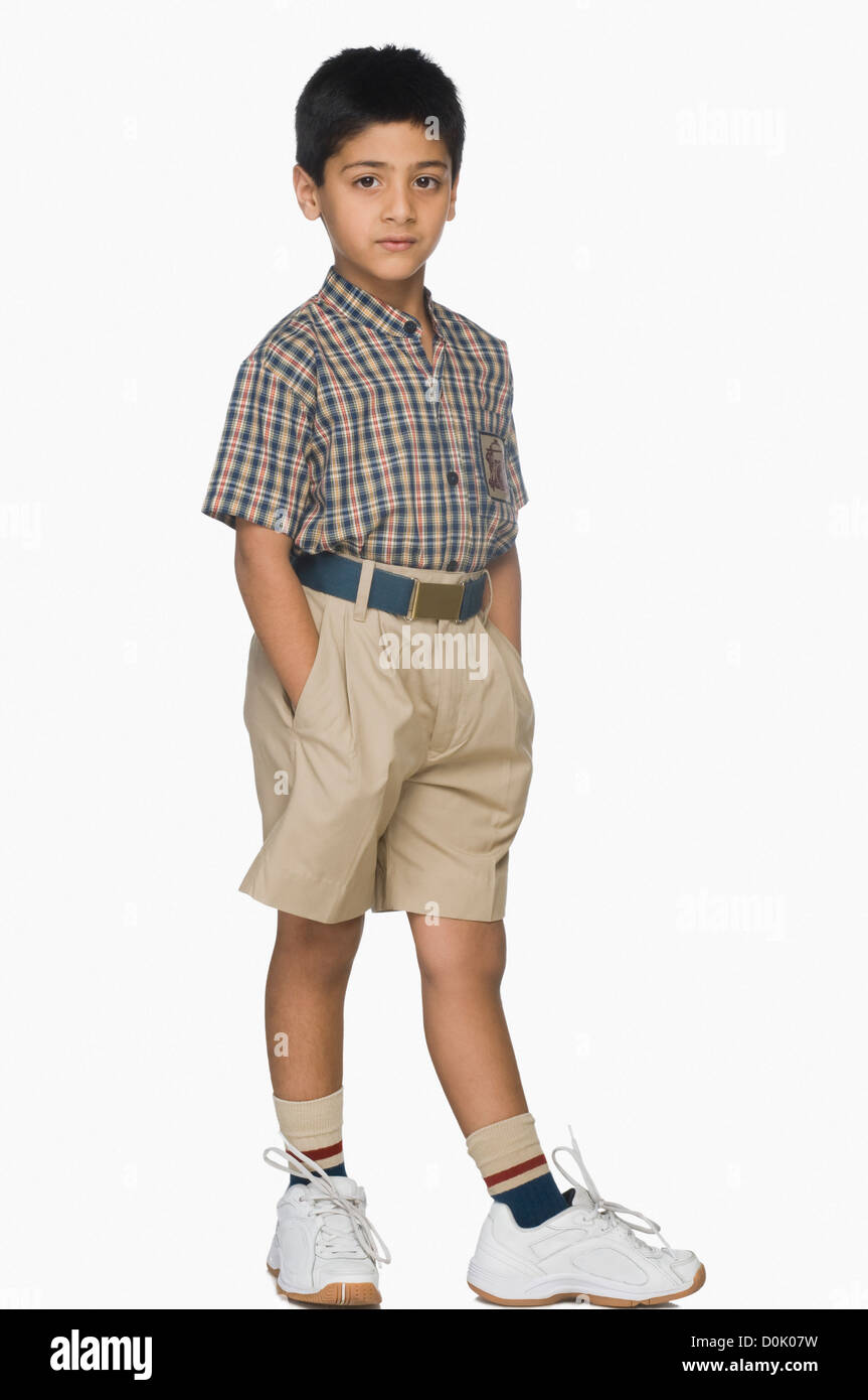 Portrait of a boy standing with his hands in pockets Stock Photo - Alamy