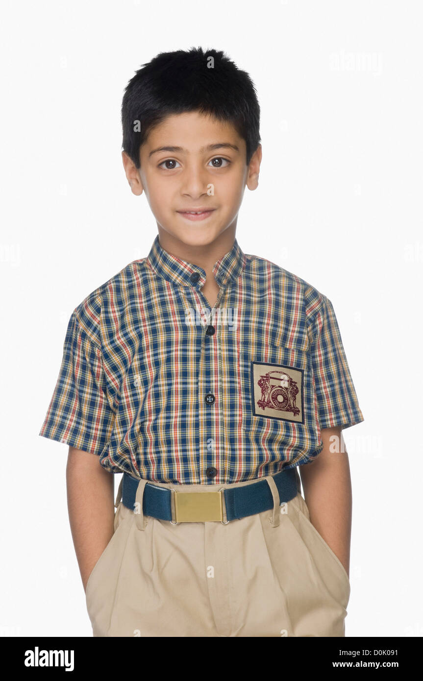 Portrait of a boy standing with his hands in pockets Stock Photo - Alamy