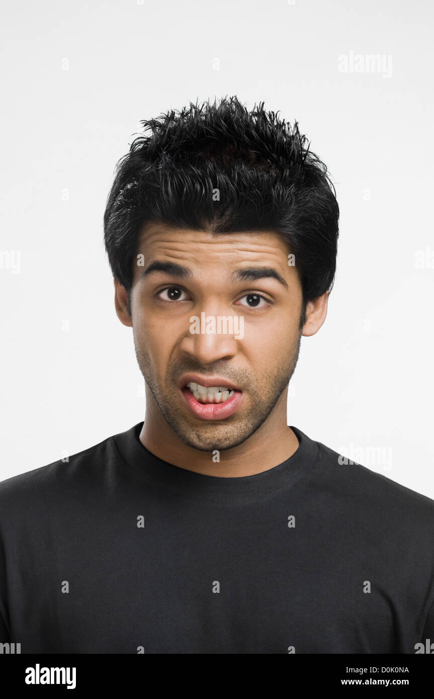 Portrait of a man grimacing Stock Photo - Alamy