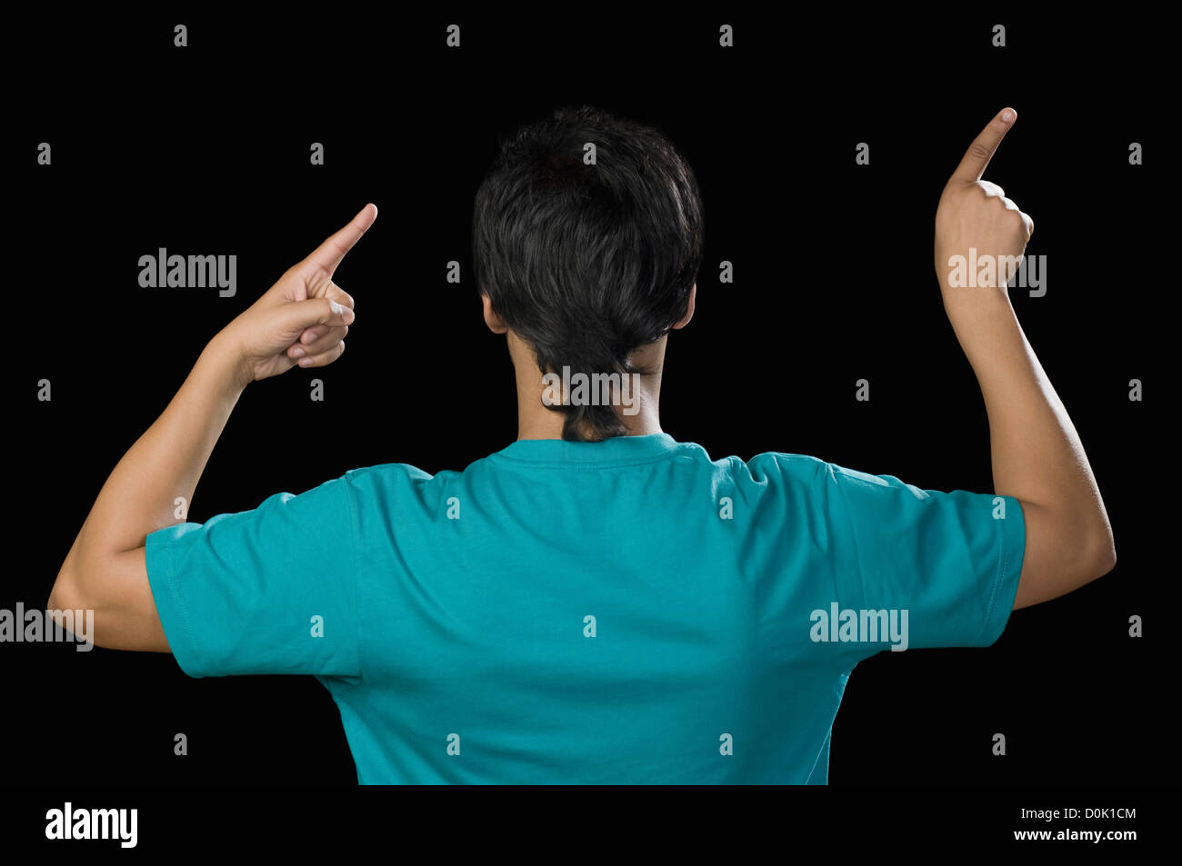Rear view of a man pointing with his fingers Stock Photo - Alamy
