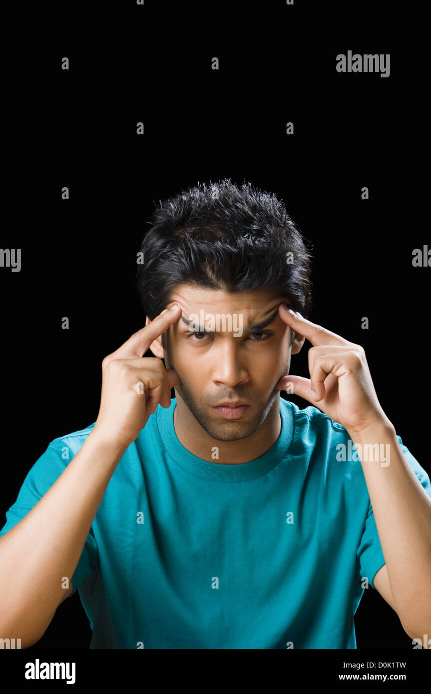 Portrait of a man touching his temple Stock Photo - Alamy Portrait of a man touching his temple Stock Photo - Alamy