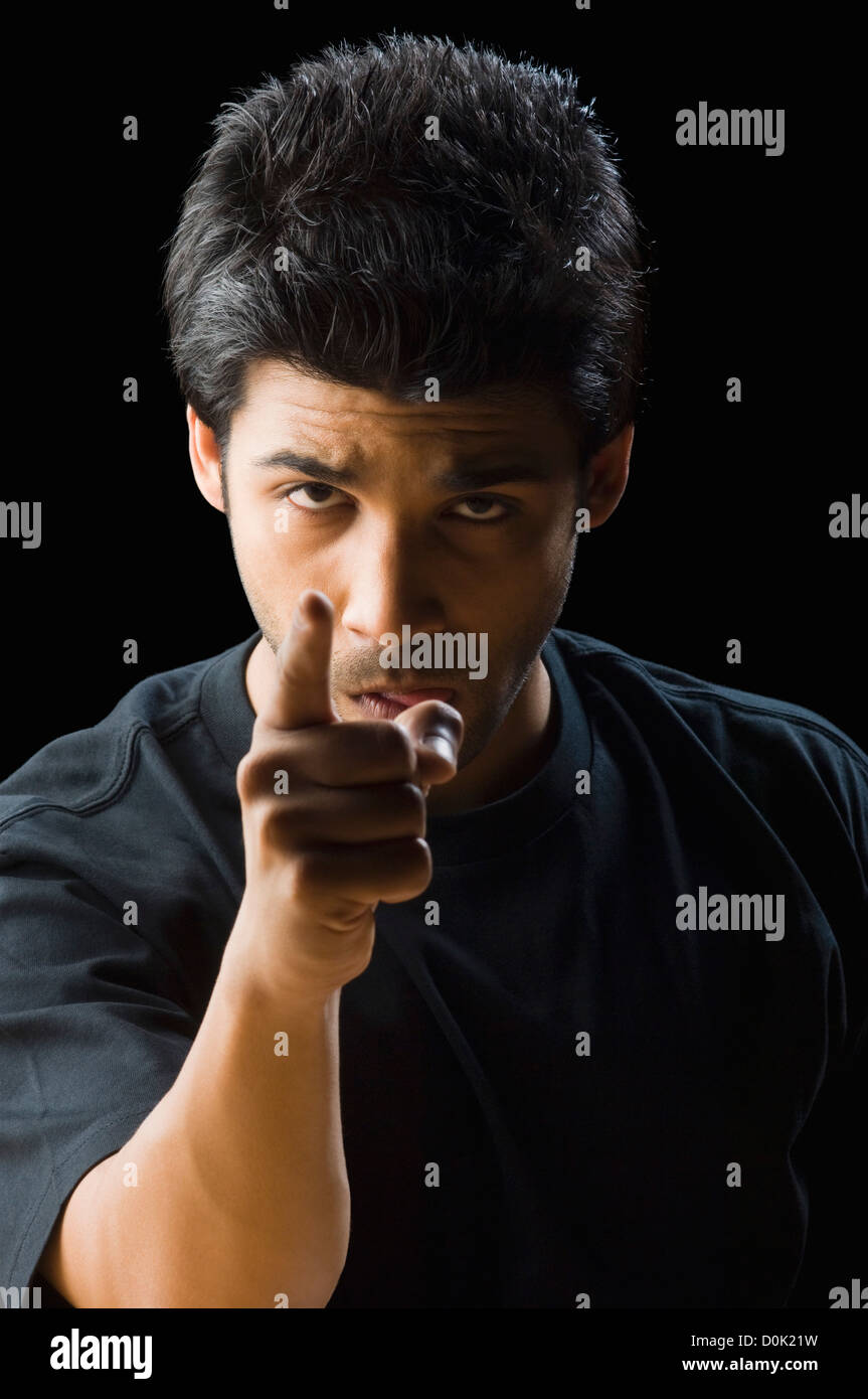 Portrait of a man pointing Stock Photo - Alamy