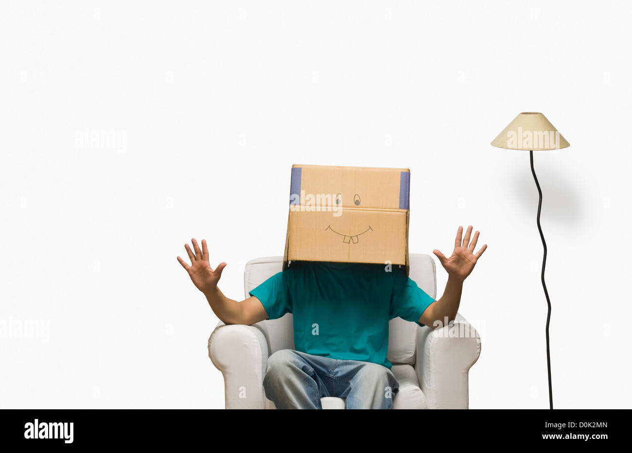 Man covering his face in a cardboard box Stock Photo - Alamy