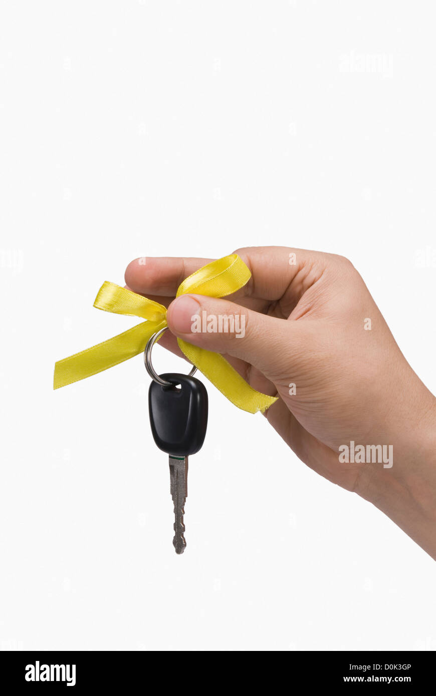 Close-up of a person's hand holding a car key Stock Photo - Alamy