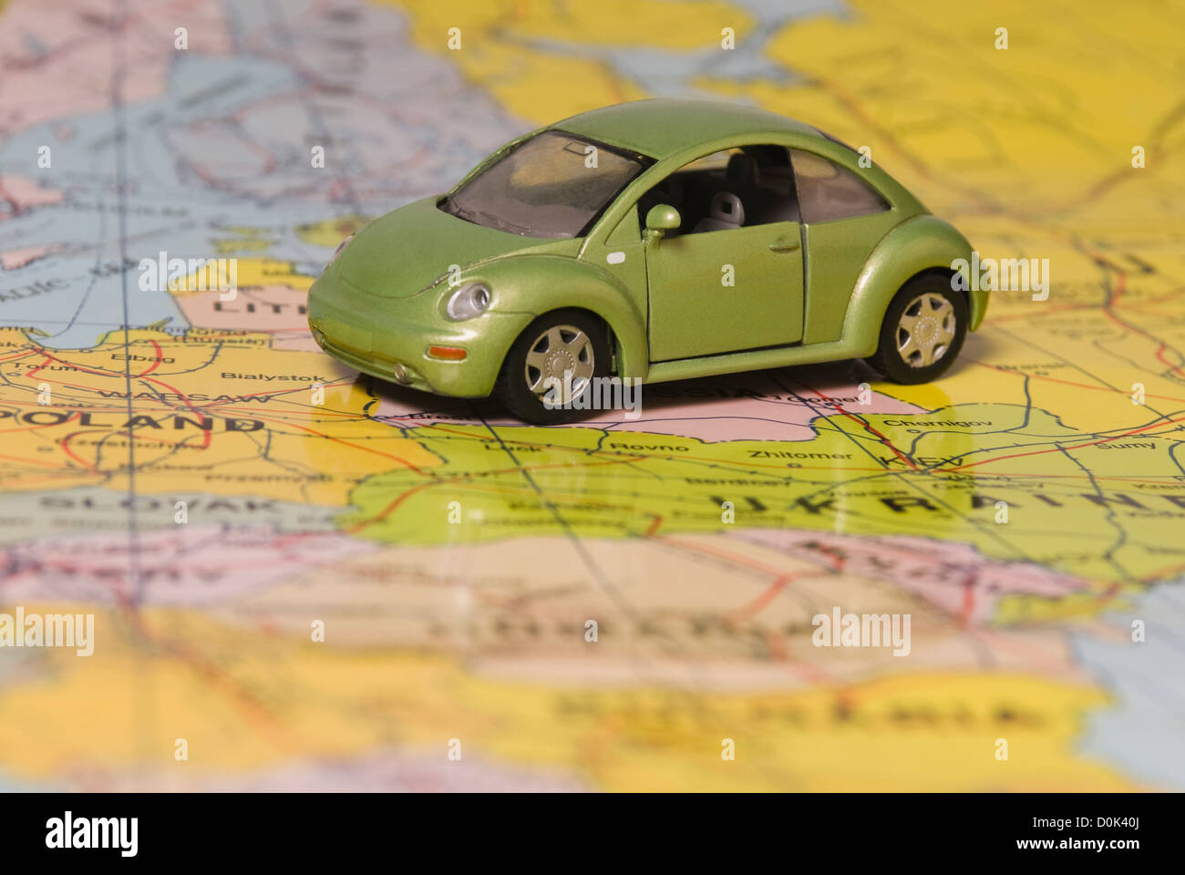Close-up of a toy car on the world map Stock Photo - Alamy