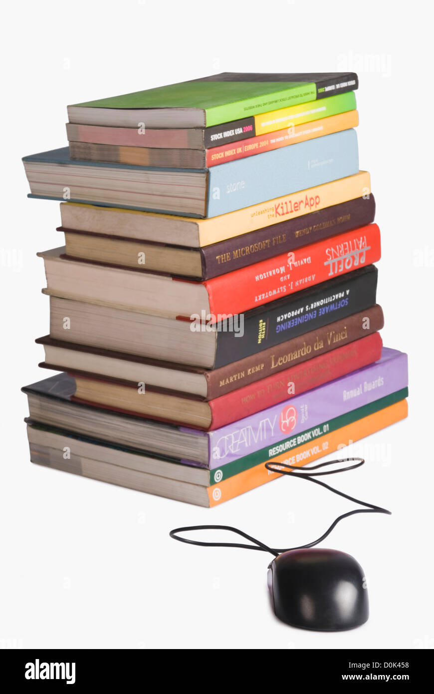 Close-up of a stack of books and a computer mouse Stock Photo - Alamy