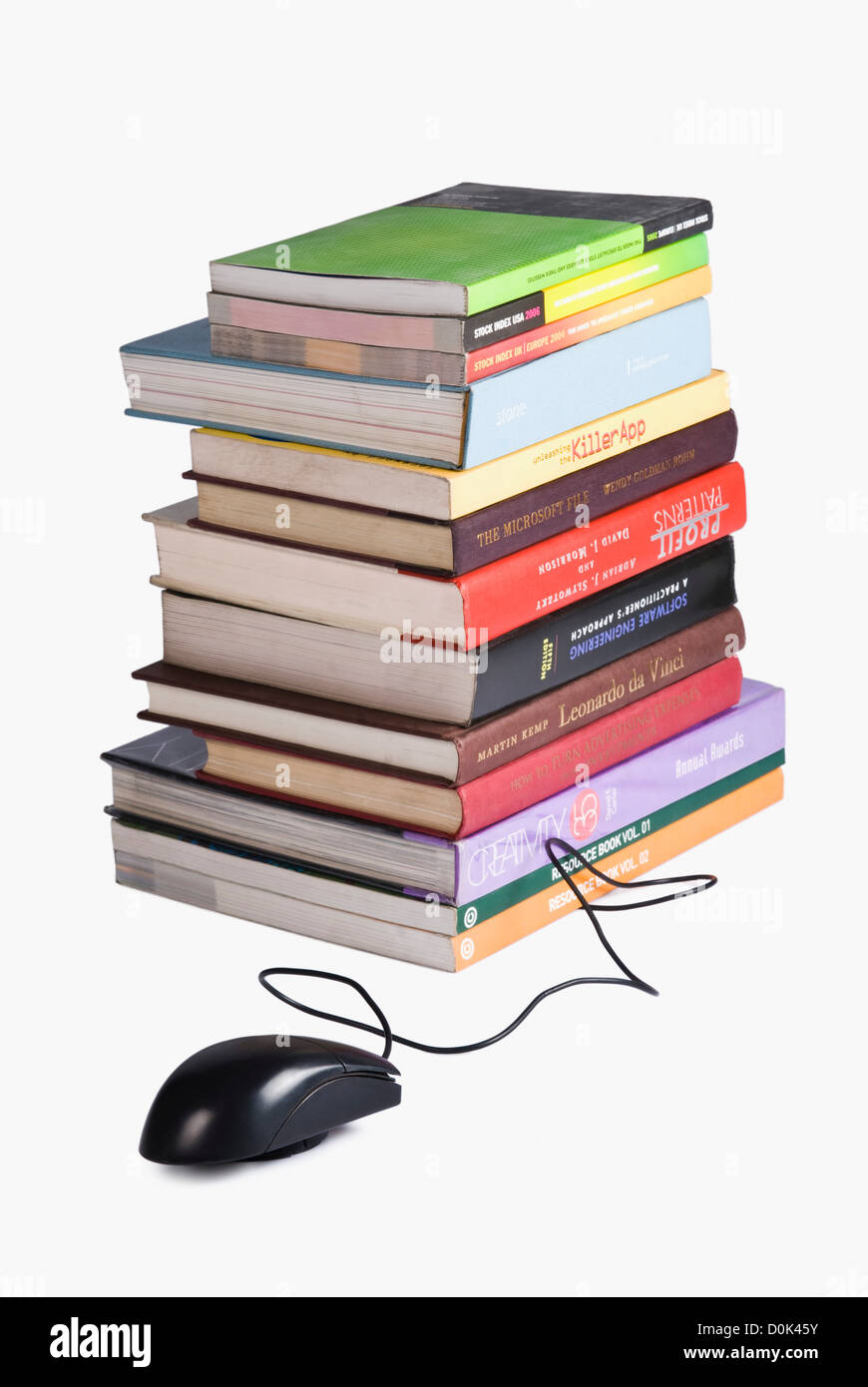 Close-up of a stack of books and a computer mouse Stock Photo - Alamy