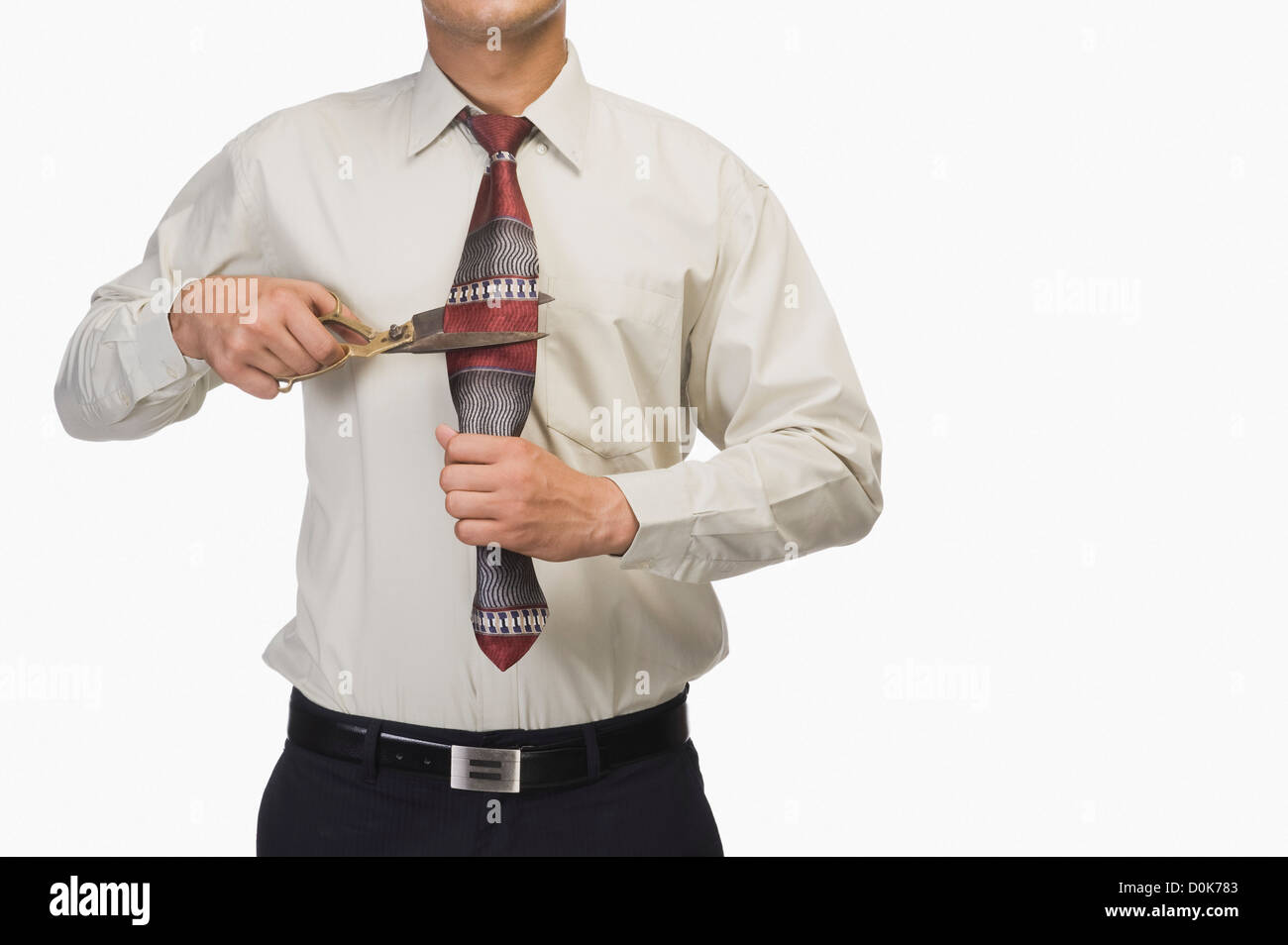 Businessman cutting his tie by scissors Stock Photo - Alamy