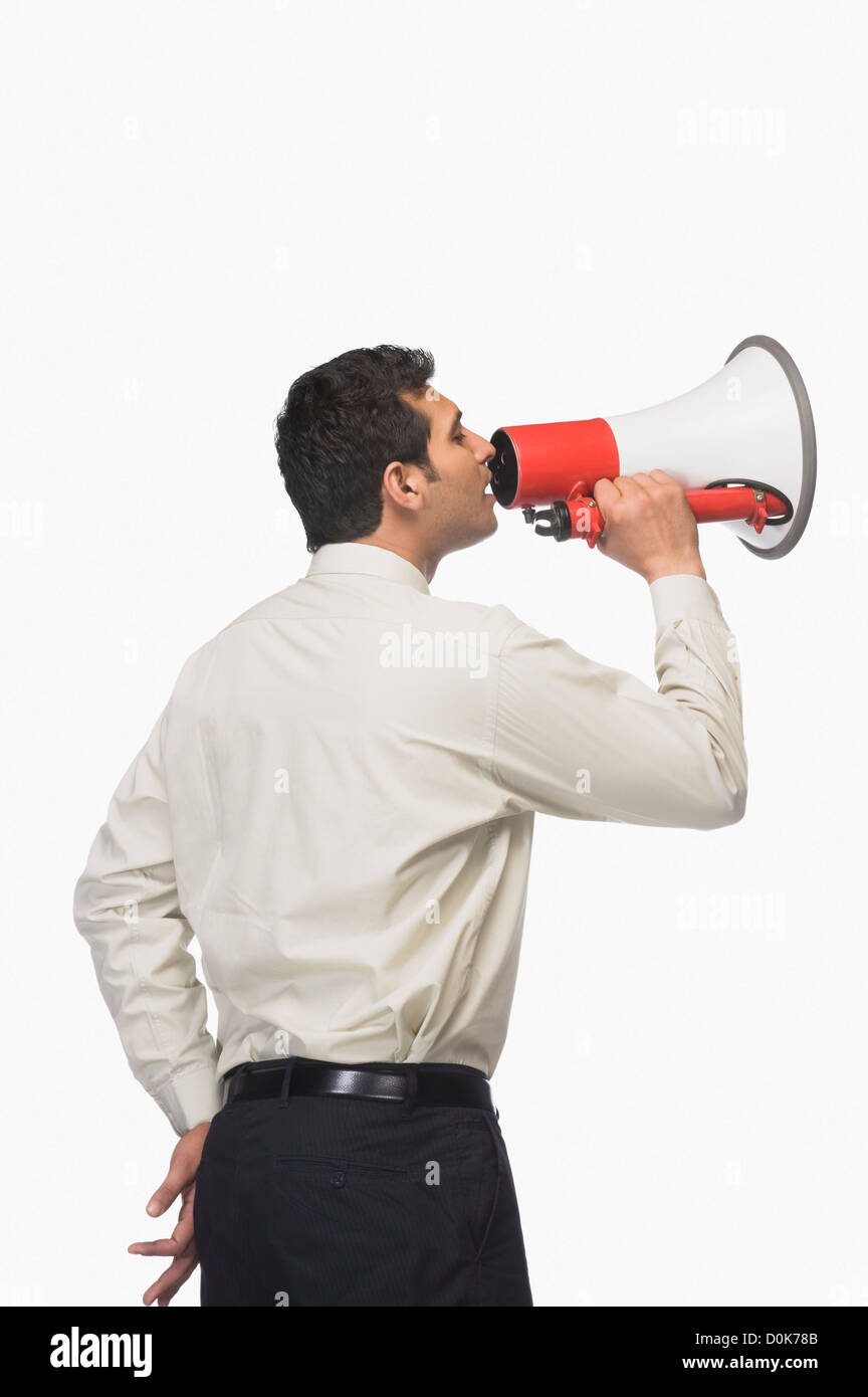 Businessman announcing into a megaphone Stock Photo - Alamy