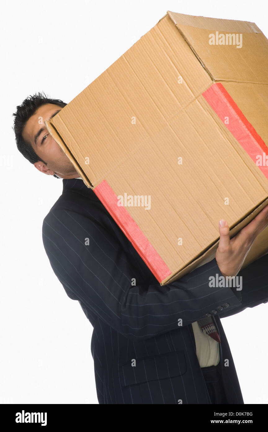 Businessman holding a cardboard box Stock Photo - Alamy
