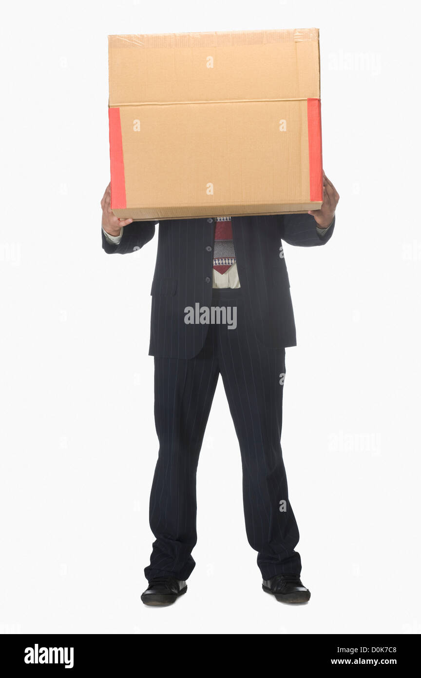 Office worker holding box Cut Out Stock Images & Pictures - Alamy