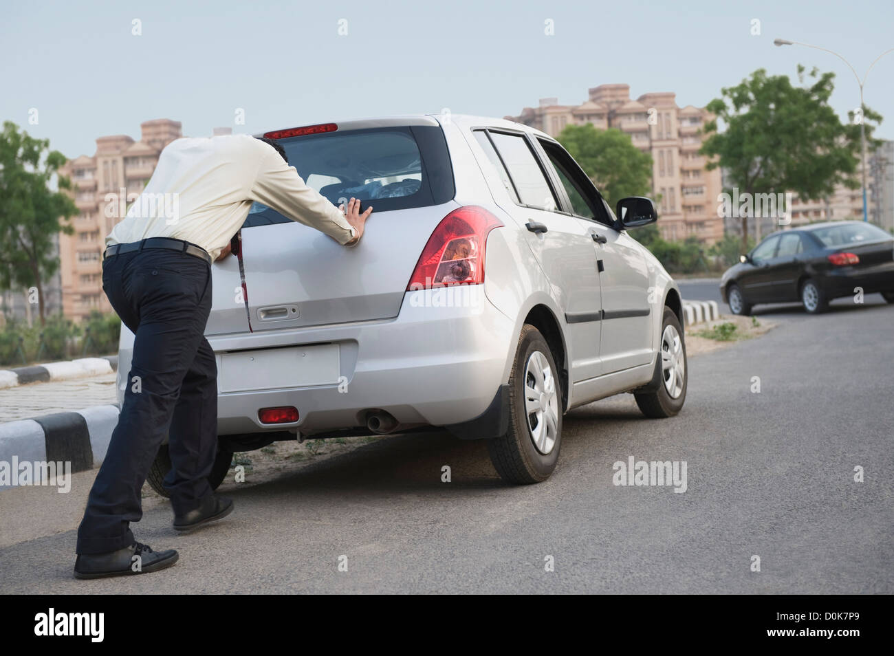 Businessman pushing his car Stock Photo - Alamy Businessman pushing his car Stock Photo - Alamy