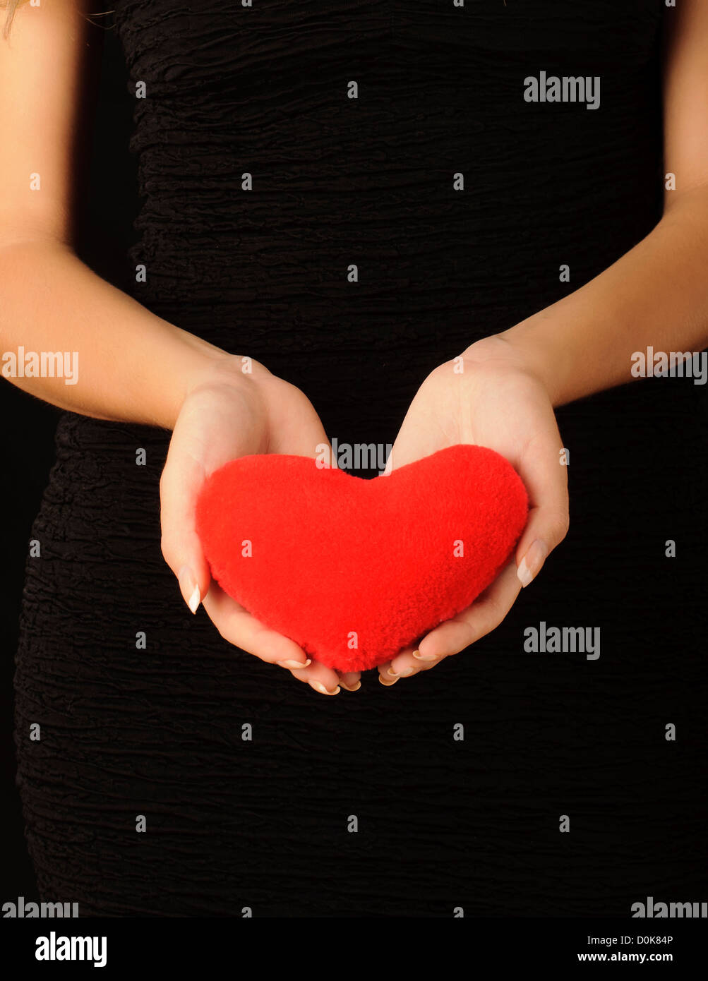 Holding a heart Stock Photo - Alamy