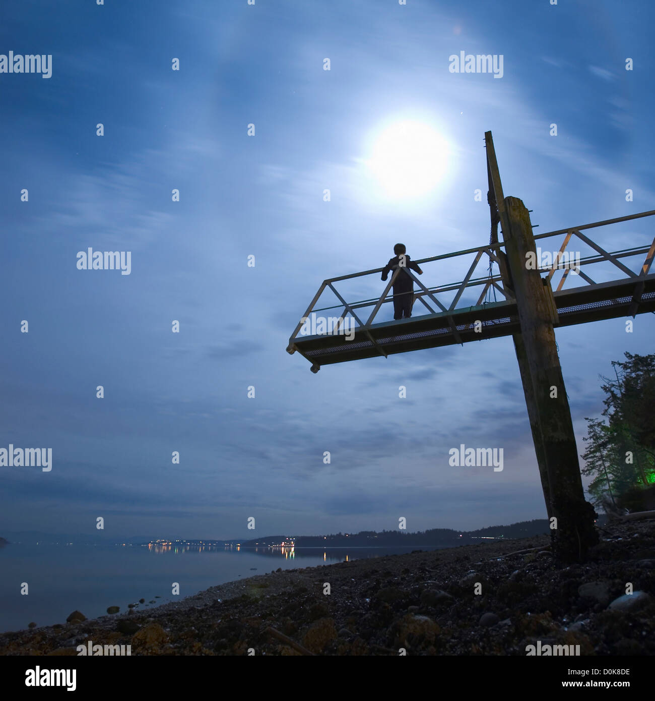 Boy on Dock Stock Photo - Alamy