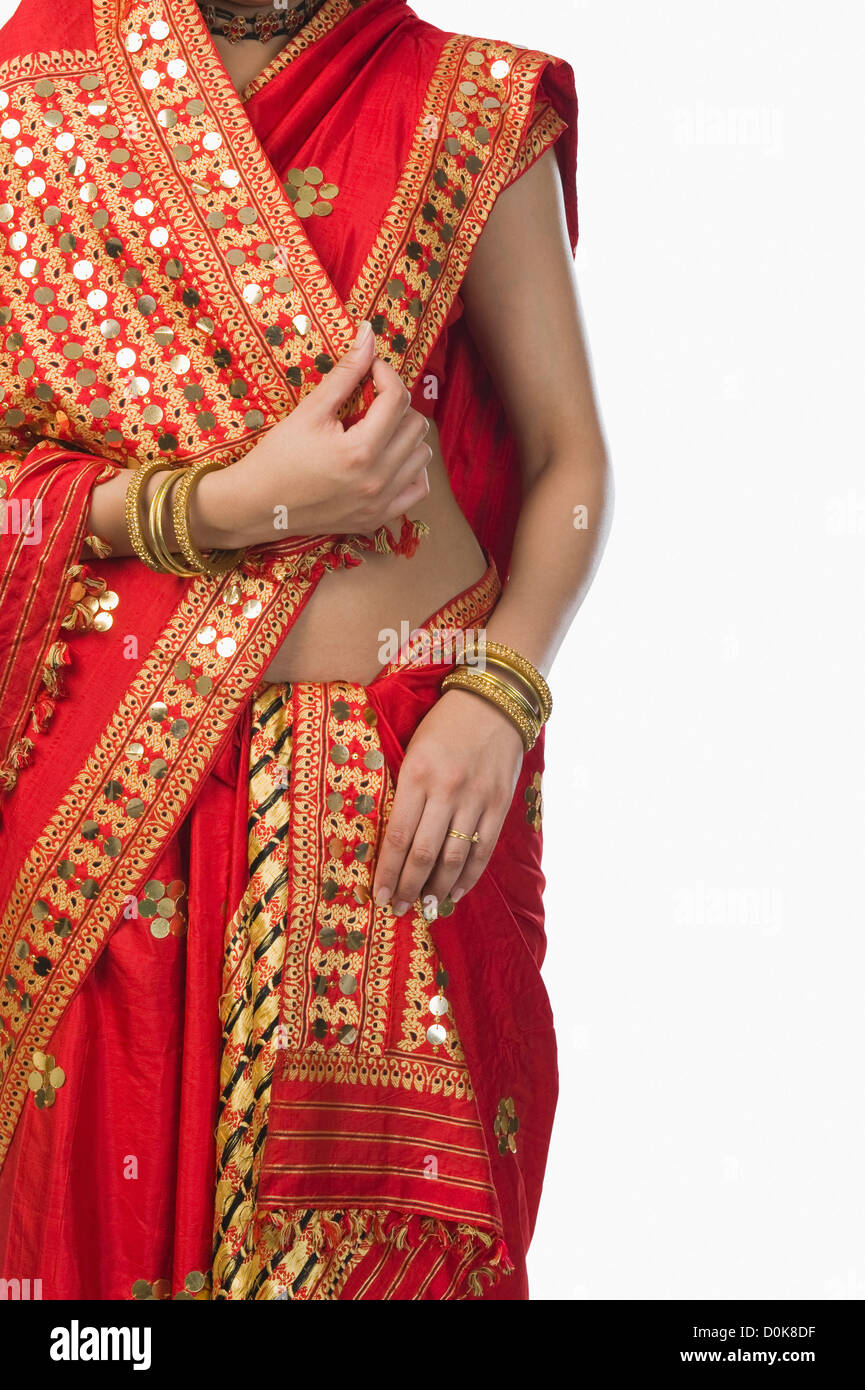 Woman in bright red mekhla Stock Photo - Alamy