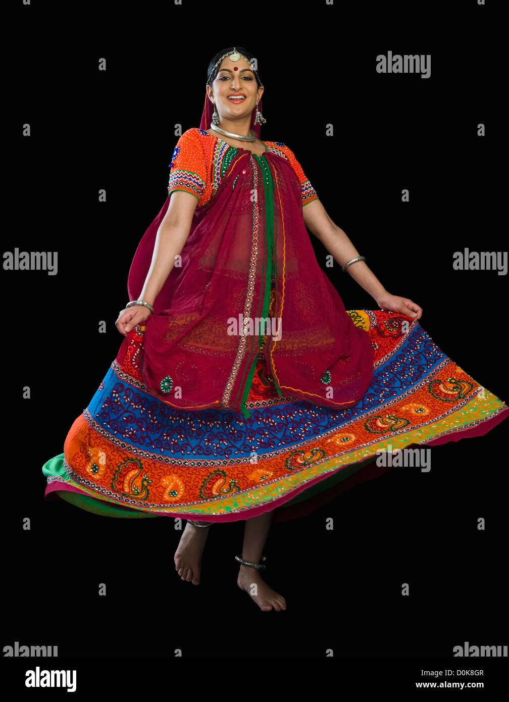 Woman dancing in colorful lehenga choli Stock Photo - Alamy