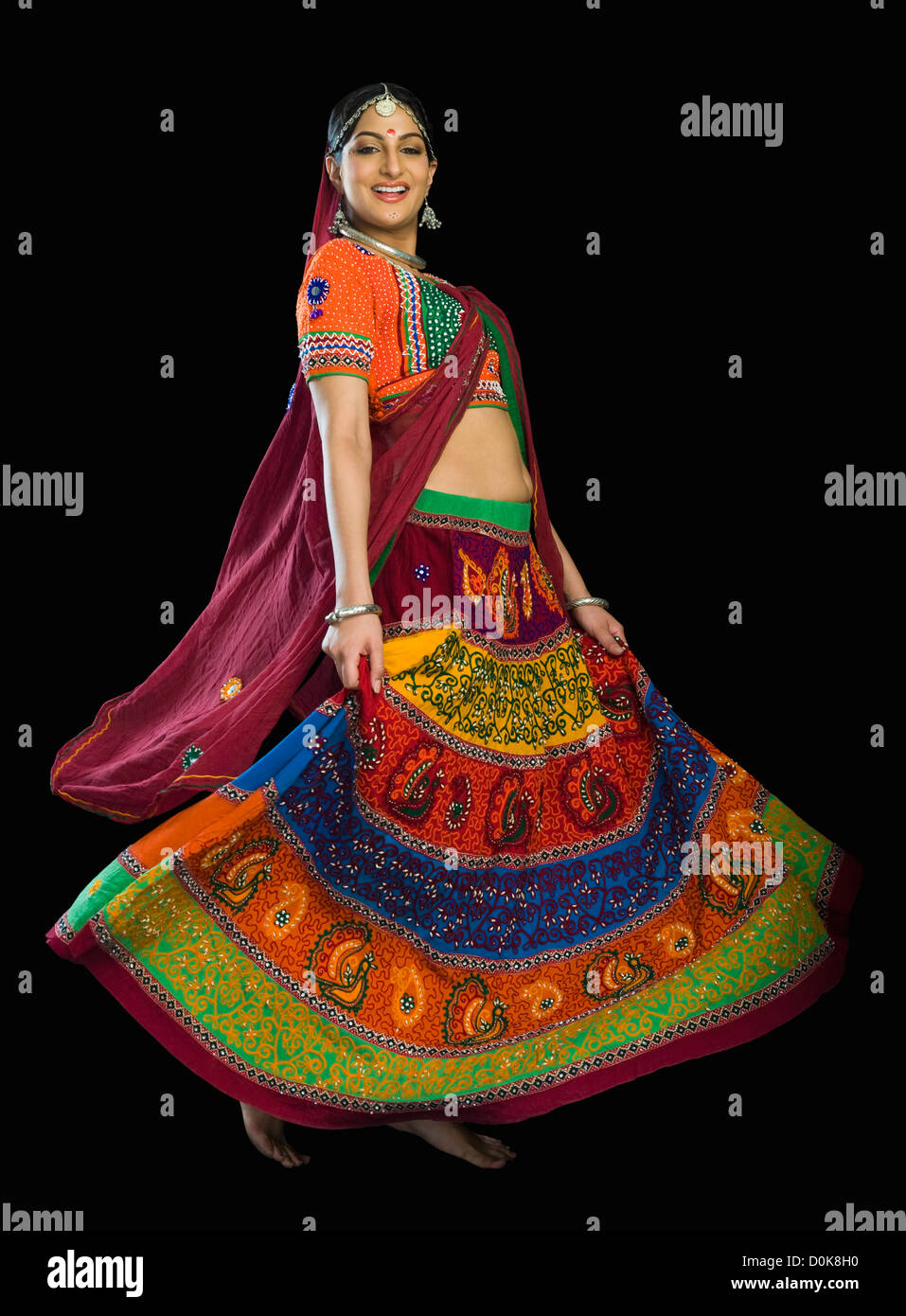 Woman dancing in colorful lehenga choli Stock Photo - Alamy