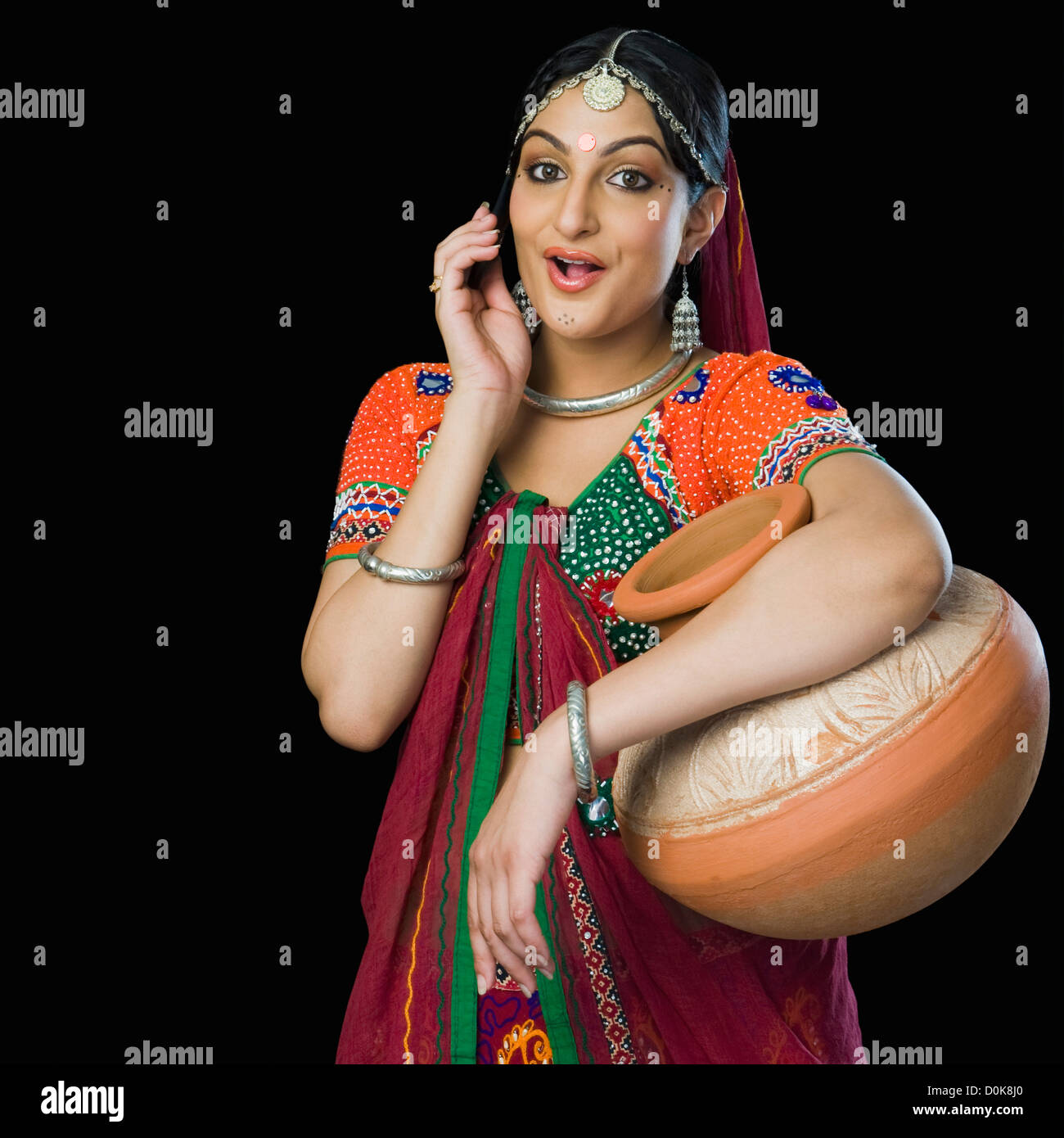 Indian woman holding water pot hi-res stock photography and images - Alamy