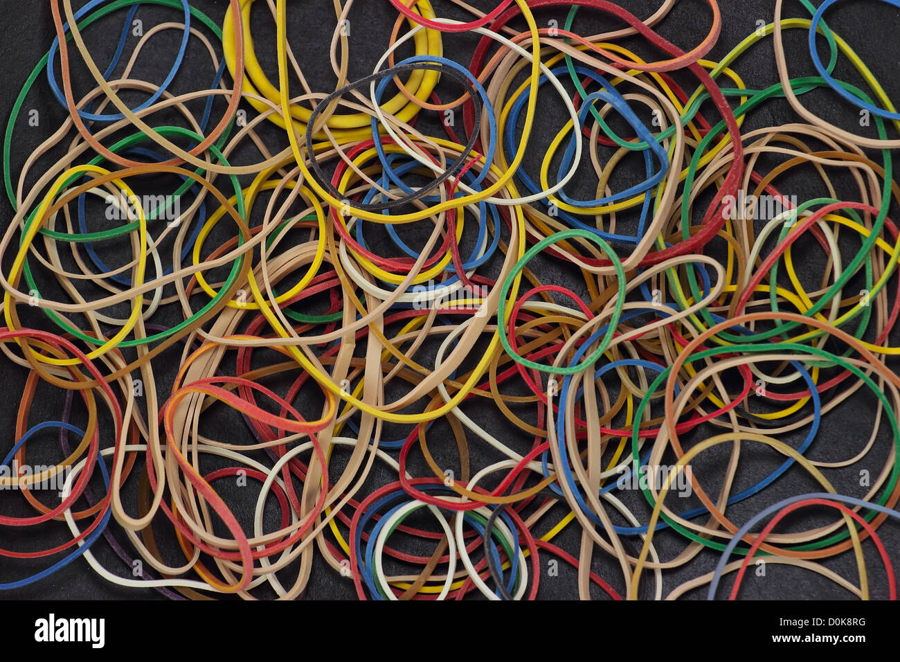 Background made with a pile of colorful rubber elastics Stock Photo - Alamy