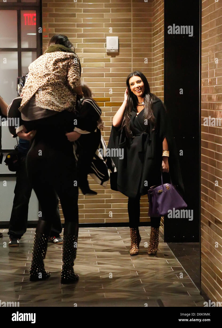 Khloe Kardashian offers her sister Kourtney Kardashian piggy back ride ... Khloe Kardashian offers her sister Kourtney Kardashian piggy back ride ...