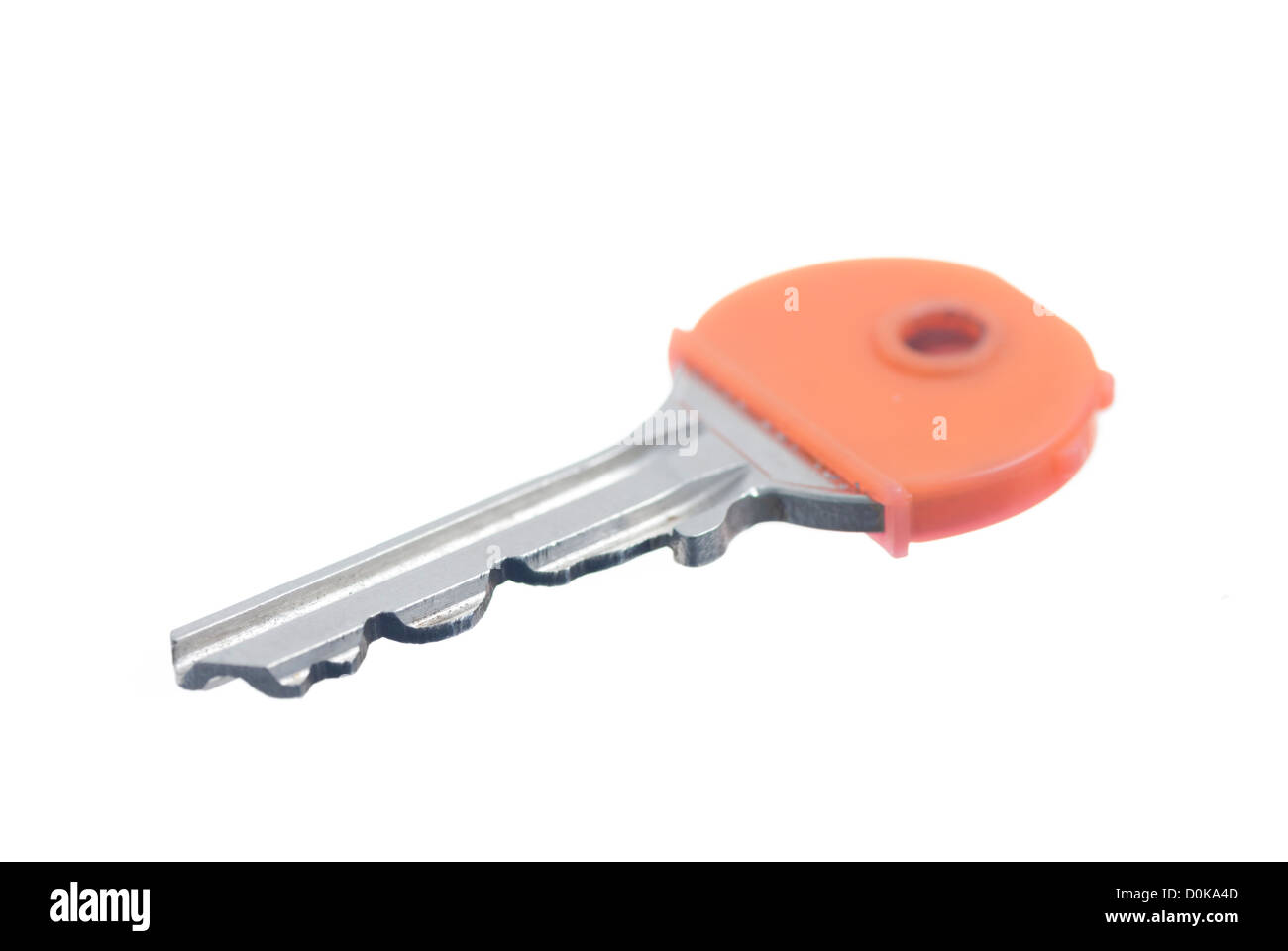 One orange house key, white background Stock Photo - Alamy