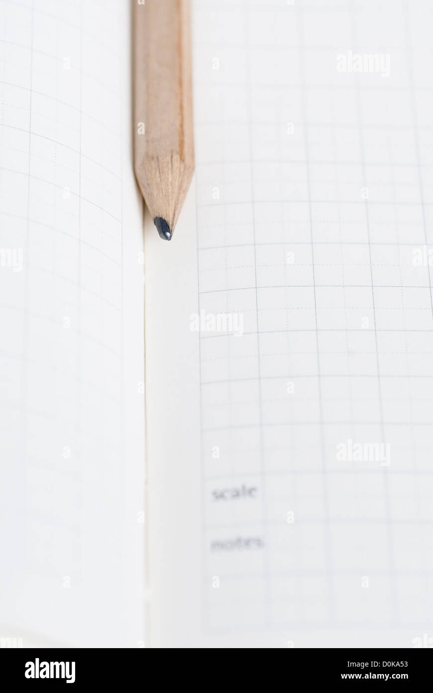 Pencil resting on blank squared note paper Stock Photo - Alamy