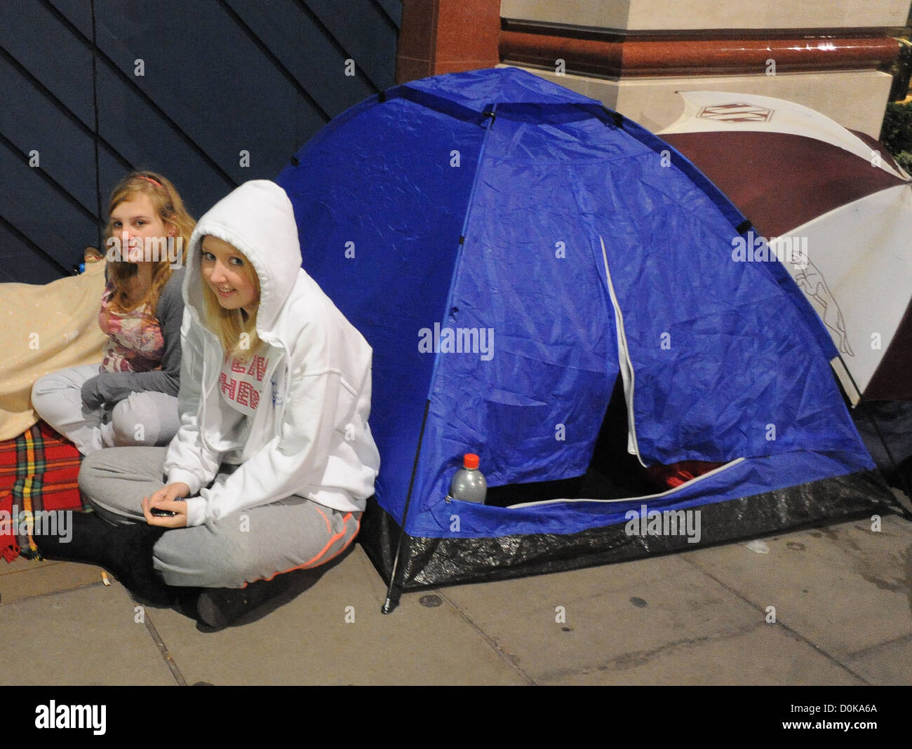 Dedicated fans queue around the block outside Waterstones bookshop in ...