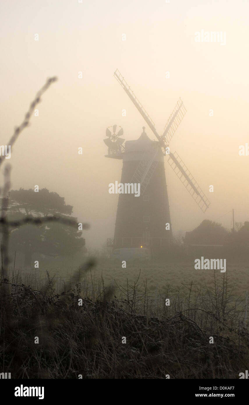 A windmill at Burnham Overy on a misty morning Stock Photo - Alamy