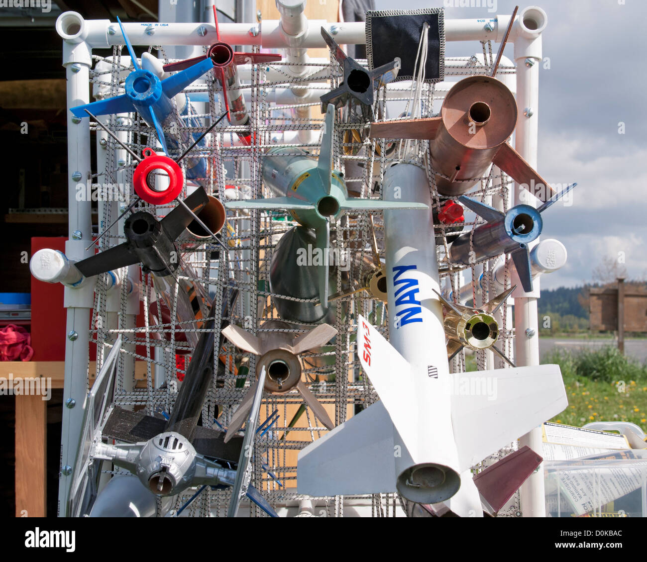 A rack full of model rockets, by a trailer, during rocketry launch ...