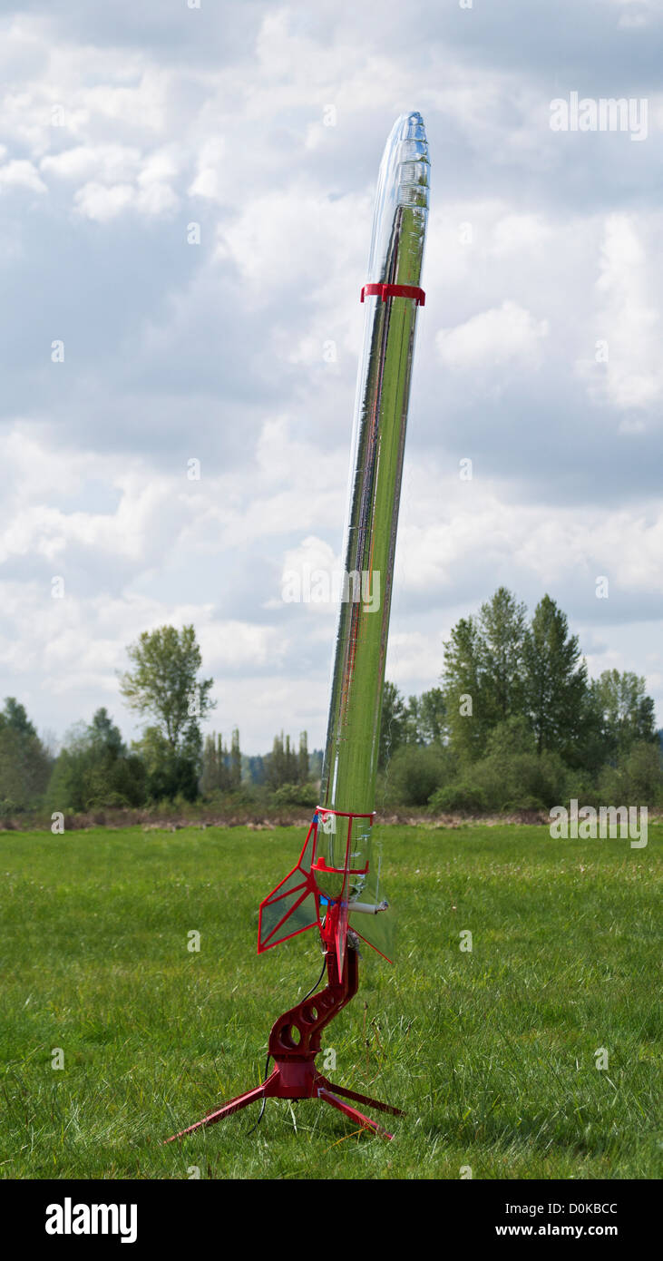 A large silver rocket on a platform ready to launch, at a model ...