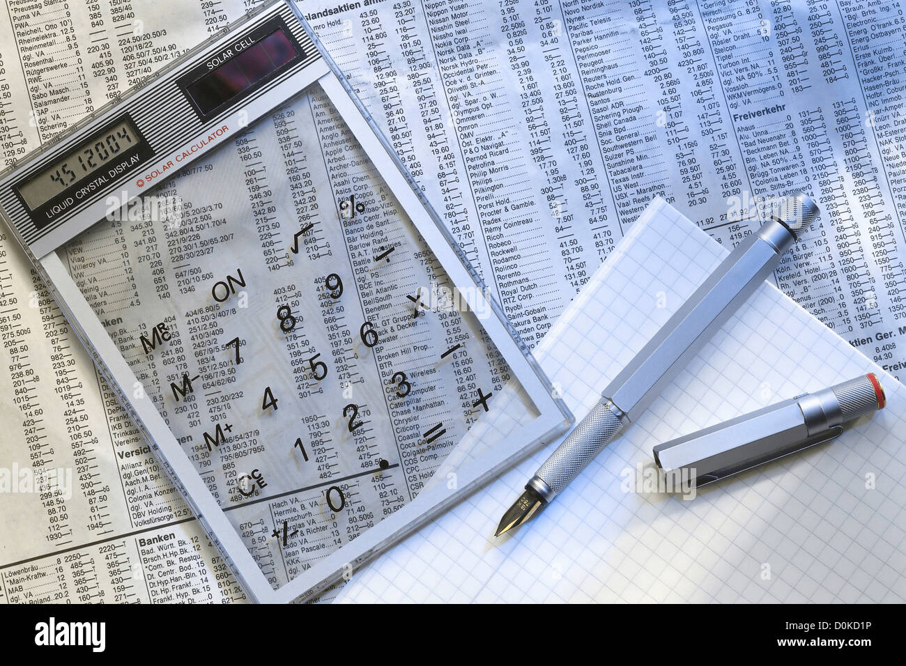 Calculator And Pen On Stock Page Stock Photo Alamy