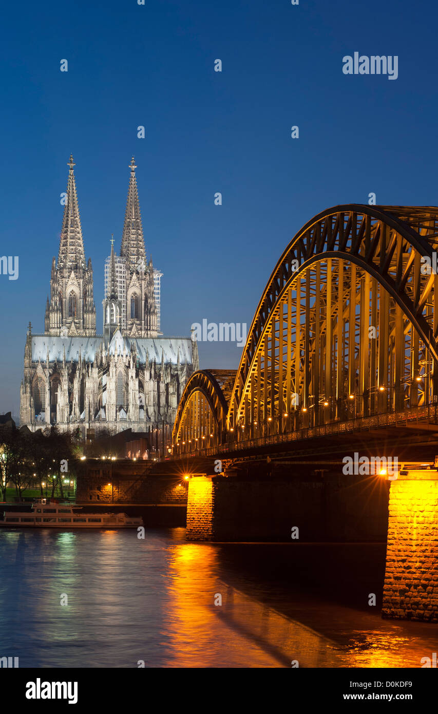 Evening view of Cologne Cathedral and Hohenzollern Bridge crossing the ...