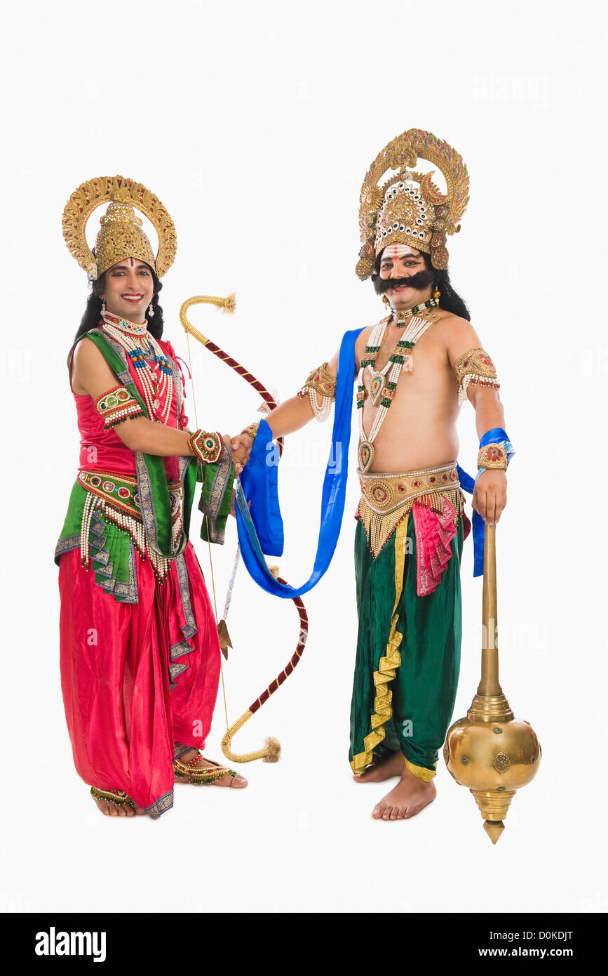 Two stage artists dressed-up as Rama and Ravana and shaking hands Stock ...