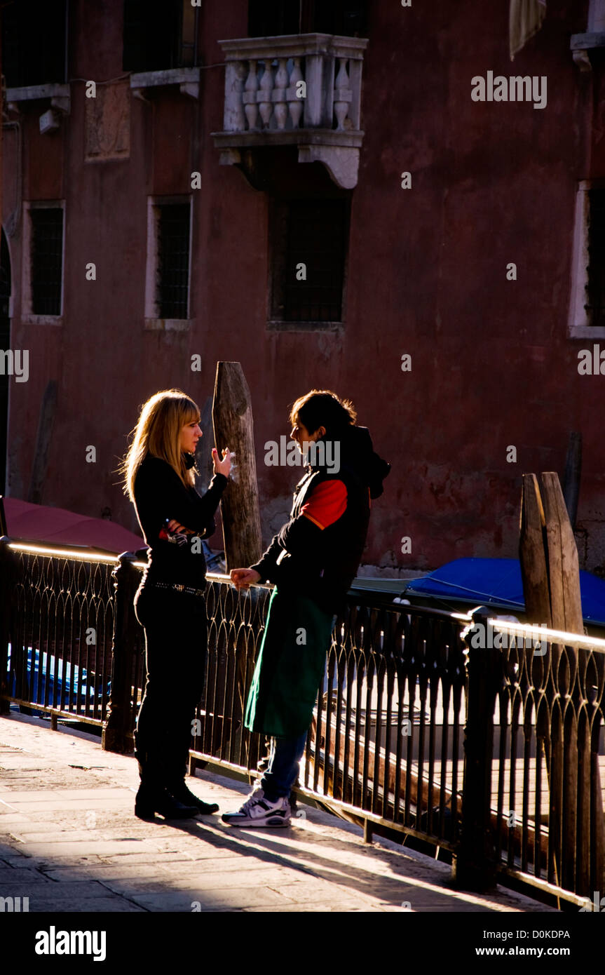 Couple man and woman talking and smoking Stock Photo - Alamy