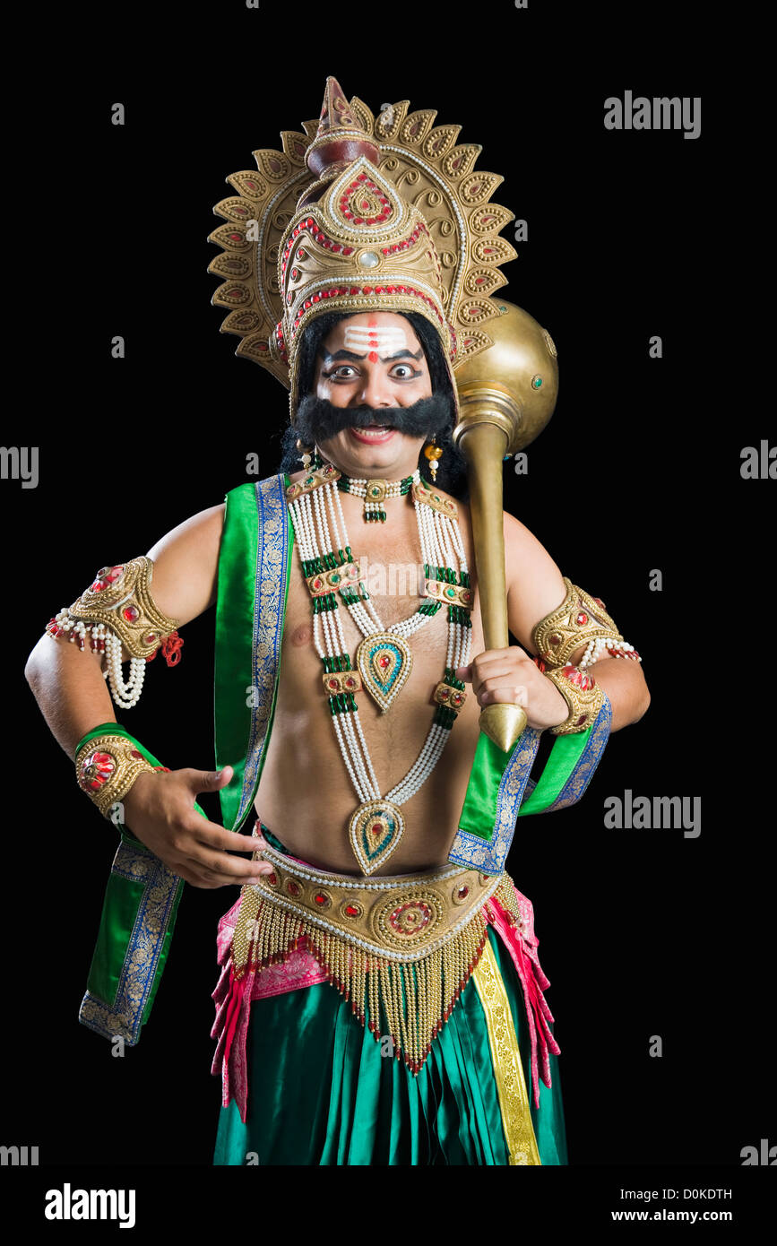 Portrait of a man dressed-up as Ravana and holding a mace Stock Photo ...