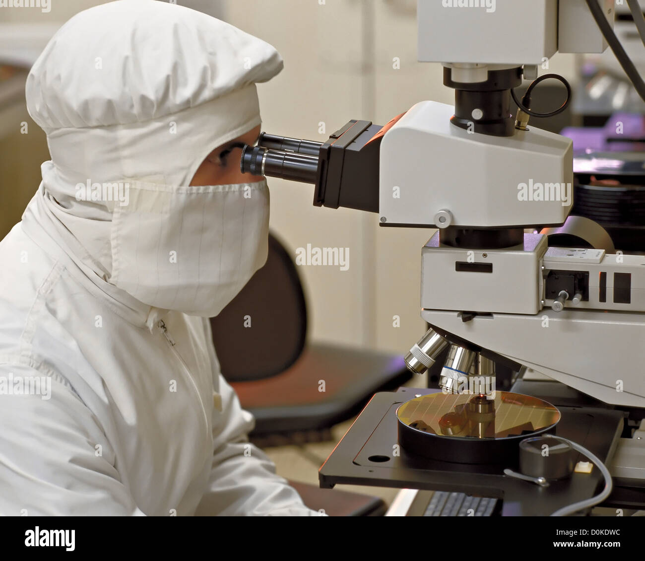 Technician Using Microscope for Quality Control Stock Photo - Alamy