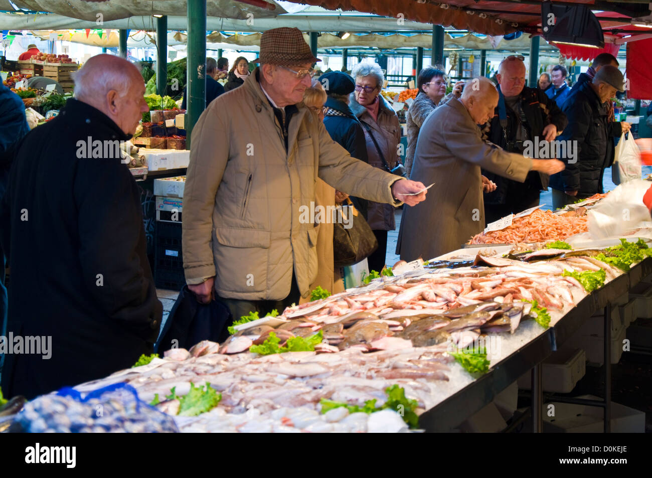 Elderly senior people buying fish from a market stall at the Fish ...