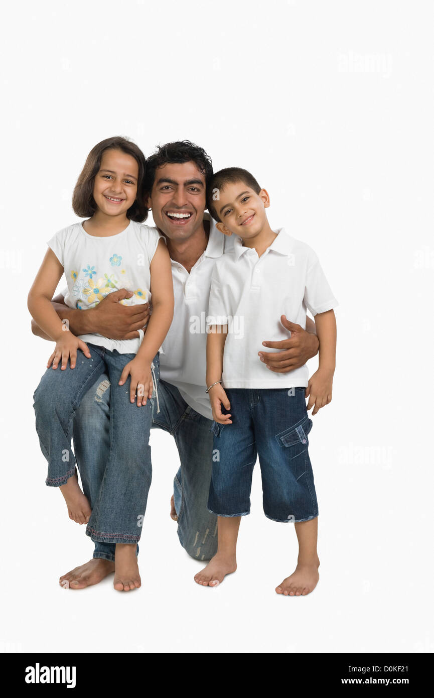 Portrait of a man smiling with his children Stock Photo - Alamy