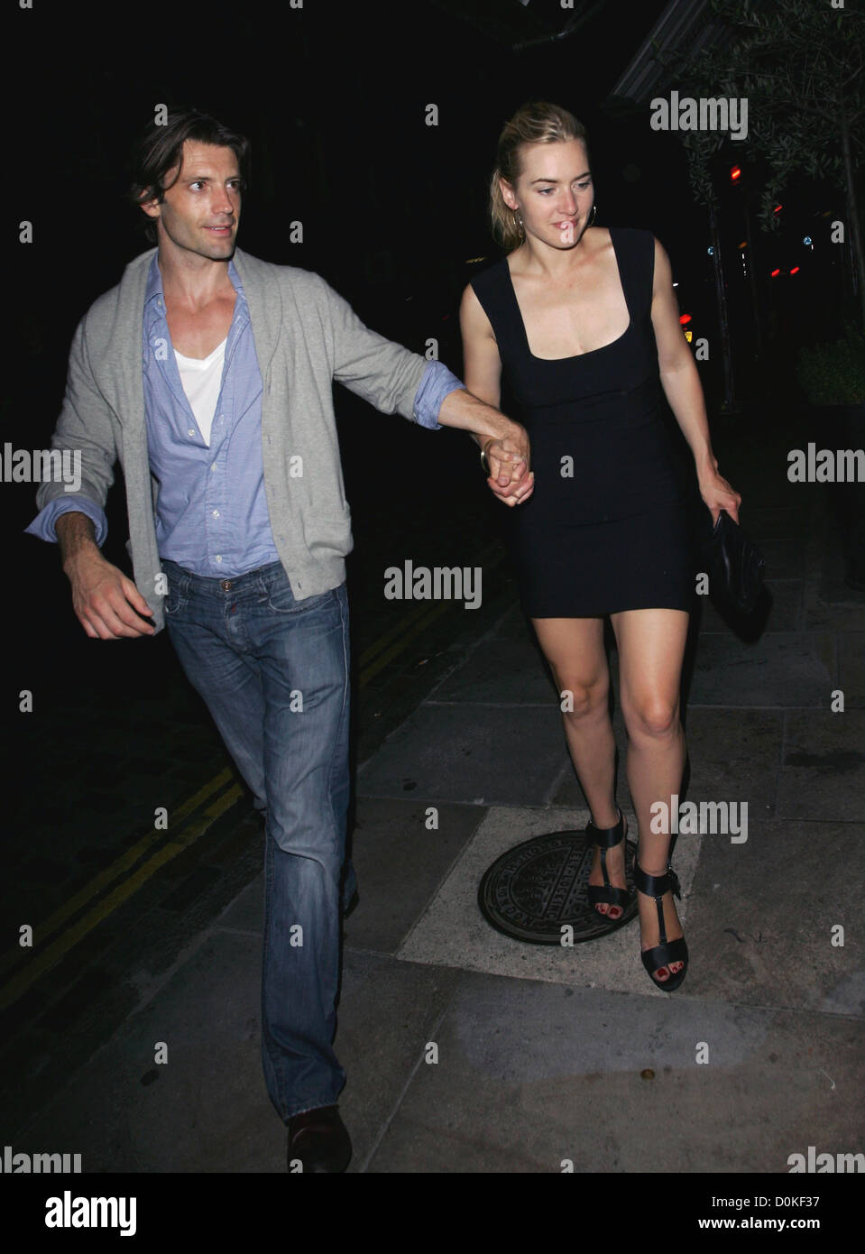 Kate Winslet returns to her hotel holding hands with Louis Dowler. It ...