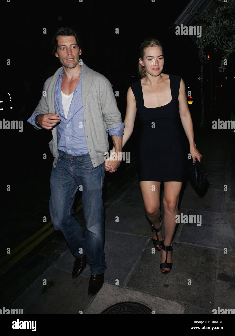 Kate Winslet returns to her hotel, holding hands with Louis Dowler. It ...