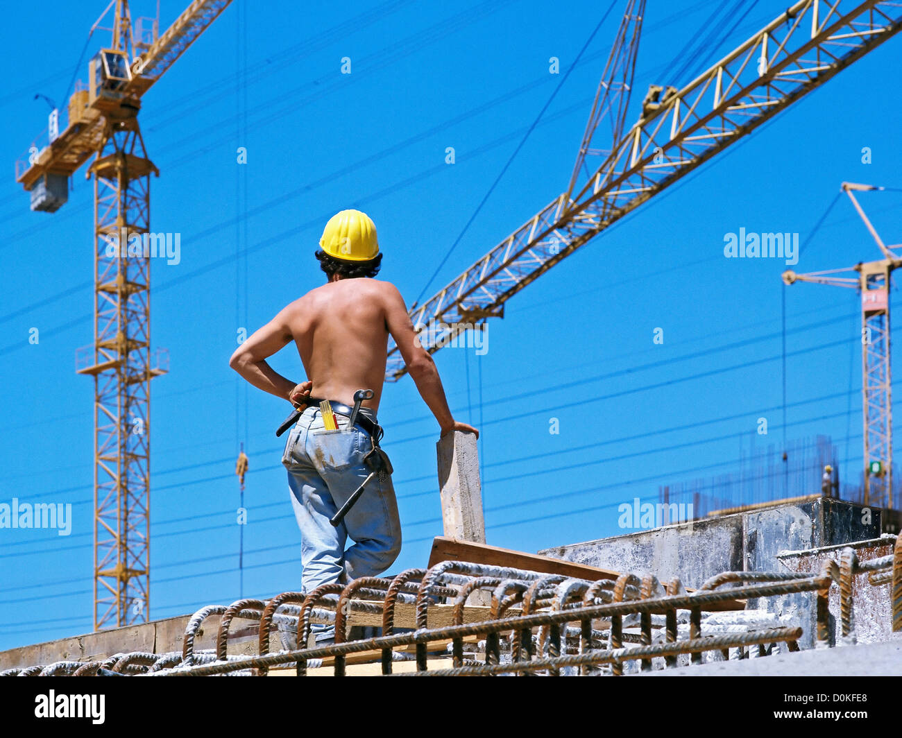 A shirtless construction worker on a building site Stock Photo - Alamy